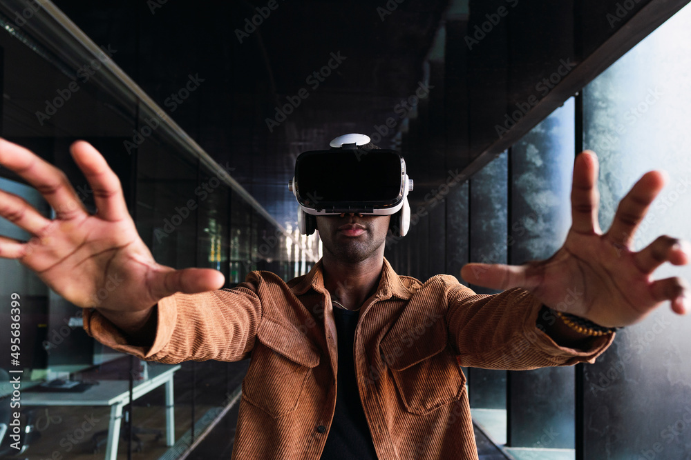 Black man exploring virtual reality in VR headset Stock Photo | Adobe Stock