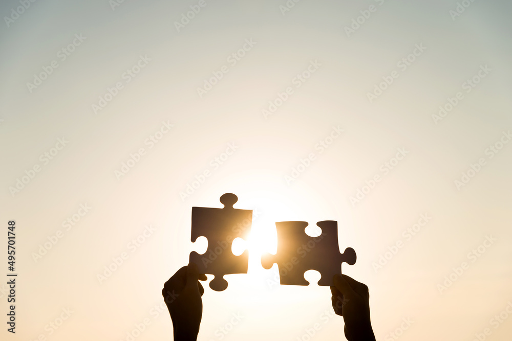 Silhouette two hands trying to connect couple puzzle piece. Stock Photo ...
