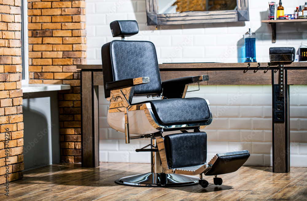 Professional hairstylist in barbershop interior. Barber shop chair ...