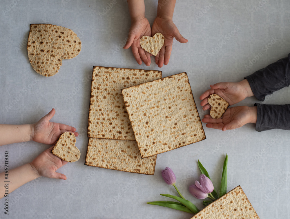 Children hands hold Matzah shape of heart. Traditional of Jewish ...