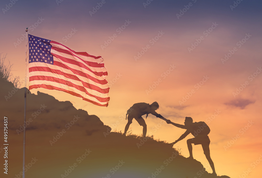 Giving a helping hand next to USA flag. American teamwork, working ...