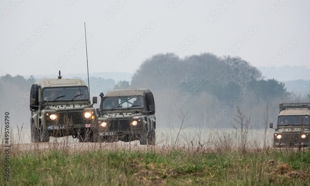 a small convoy British Army Land Rover Defender Wolf medium utility ...