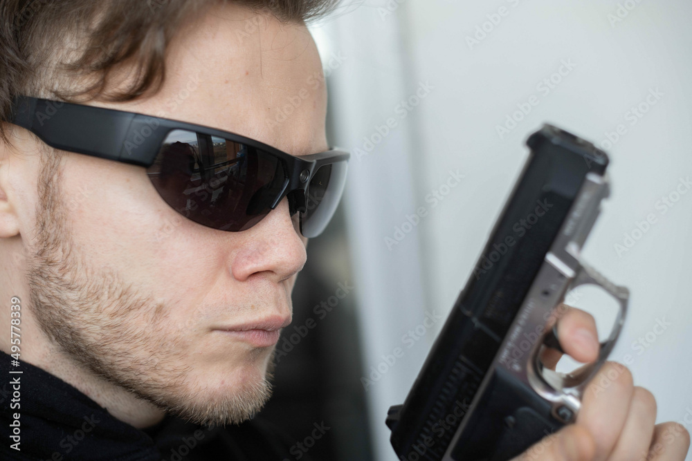 male intelligence agent, spy in black glasses with a built-in CCTV ...