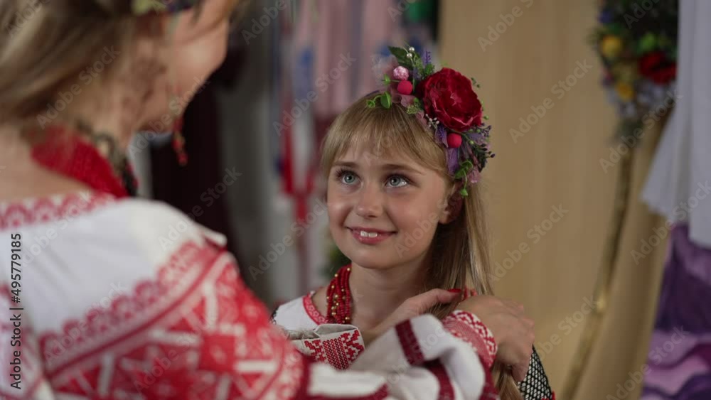 Video Stock Portrait of cute Ukrainian child smiling looking at woman ...