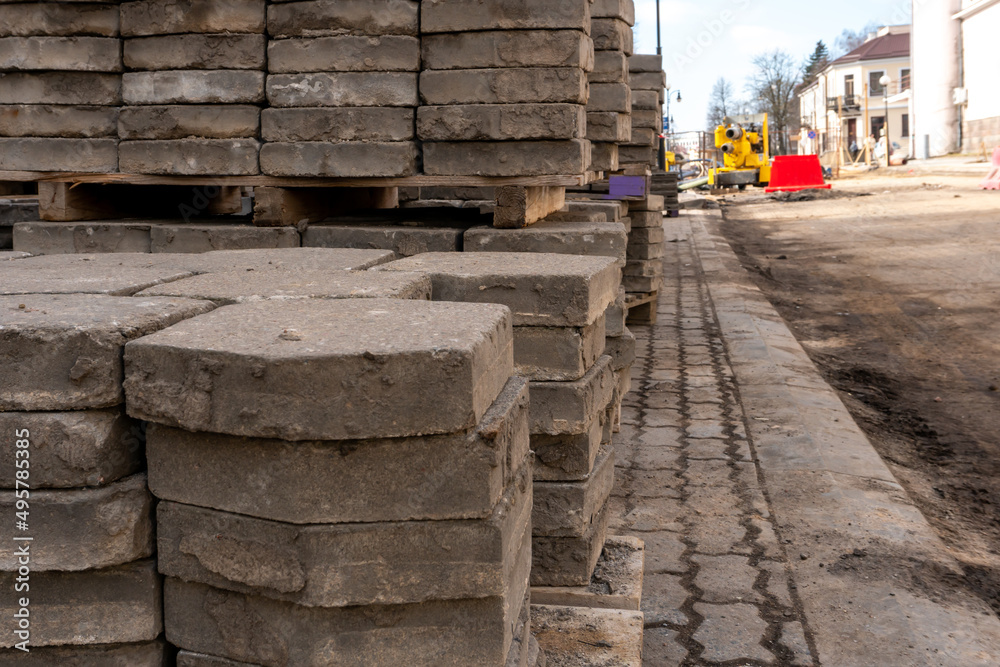 Old paving slabs in close-up. Storage of paving slabs during the repair ...