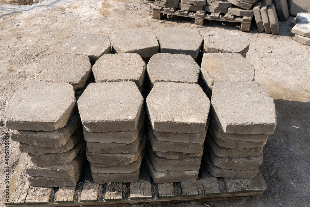 Old paving slabs in close-up. Storage of paving slabs during the repair ...