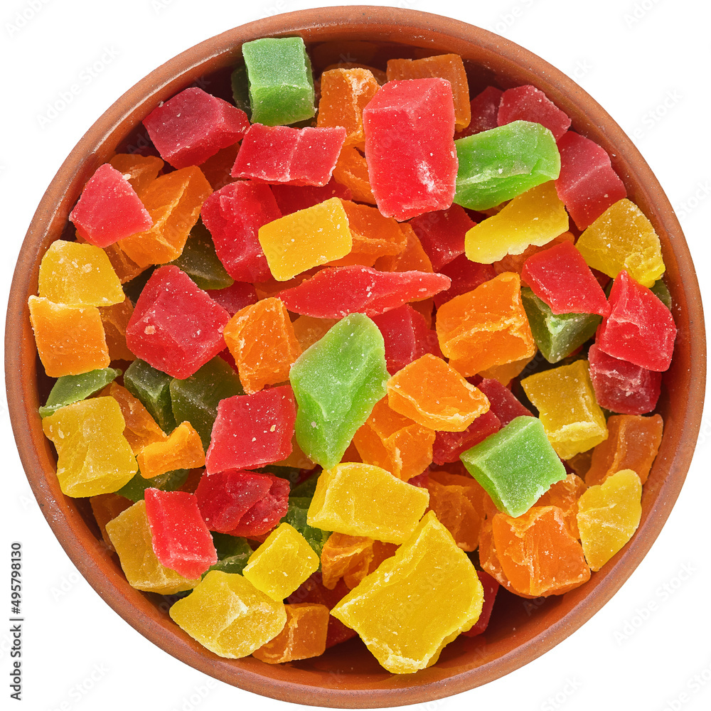 Diced candied fruits in a brown ceramic bowl. Peel of oranges, papayas ...