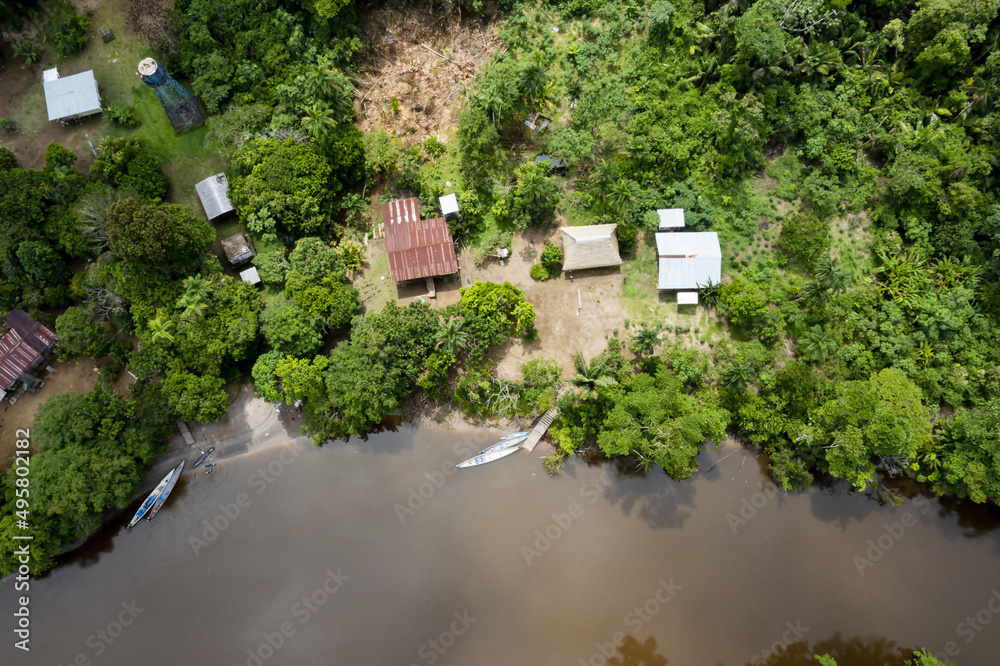 Top view of small houses in an indigenous community in the Amazon ...