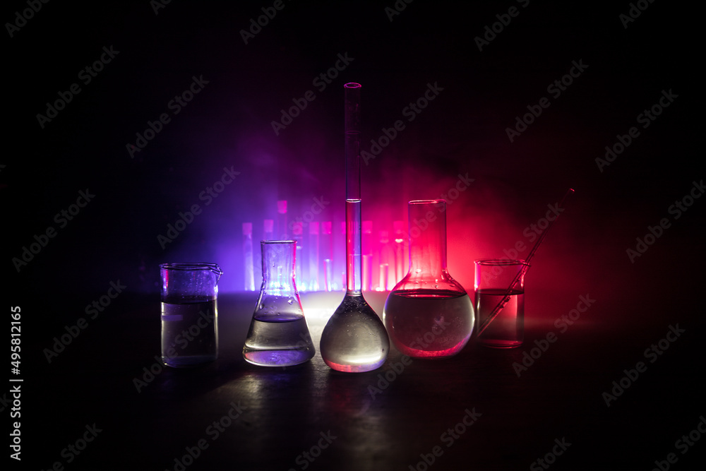 Test glass flask with solution in research laboratory. Science and ...