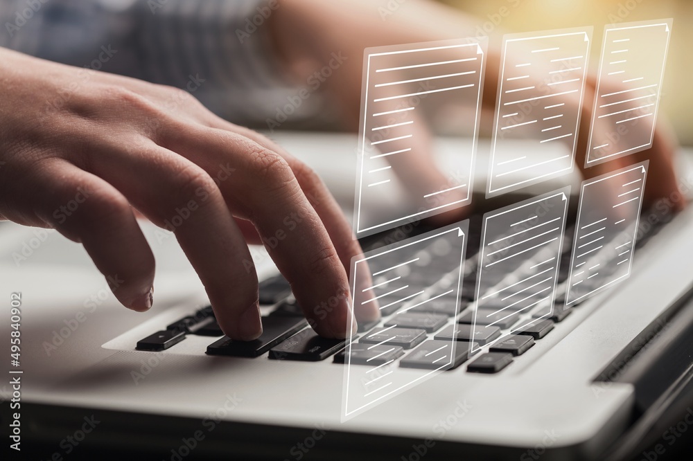 Businessman working at laptop computer and digital documents with ...
