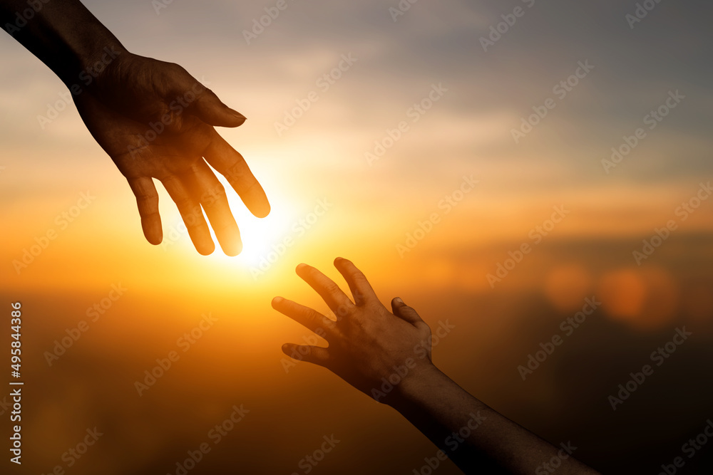 Silhouette of reaching, giving a helping hand, hope and support each ...