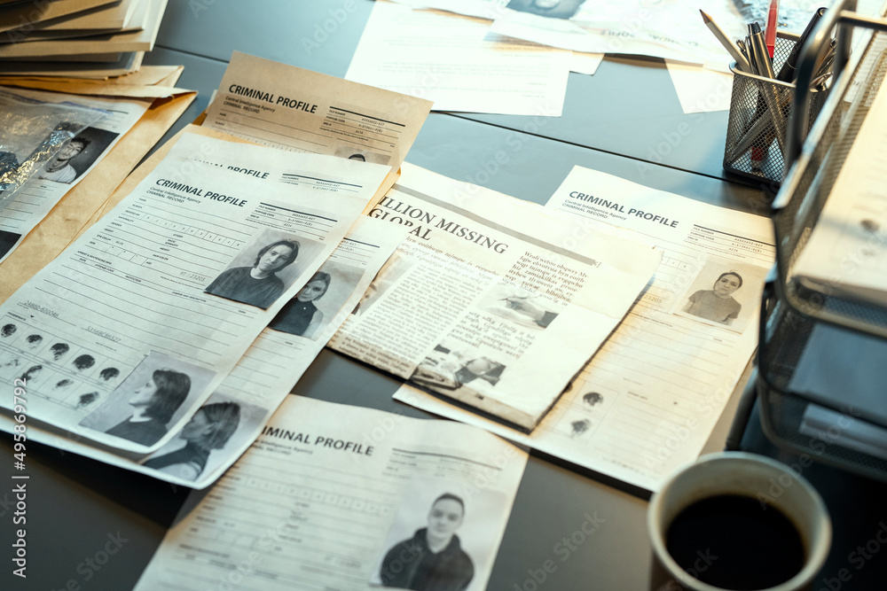 Close-up of several criminal profiles with photos of killers and ...
