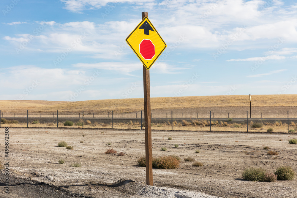 Stop Sign ahead, a yellow sign and red circle with arrow, roadside ...
