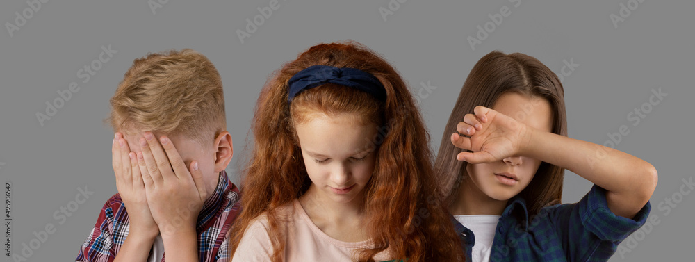 Children And Emotions Concept. Portrait Of Upset Kids Posing Over Grey ...