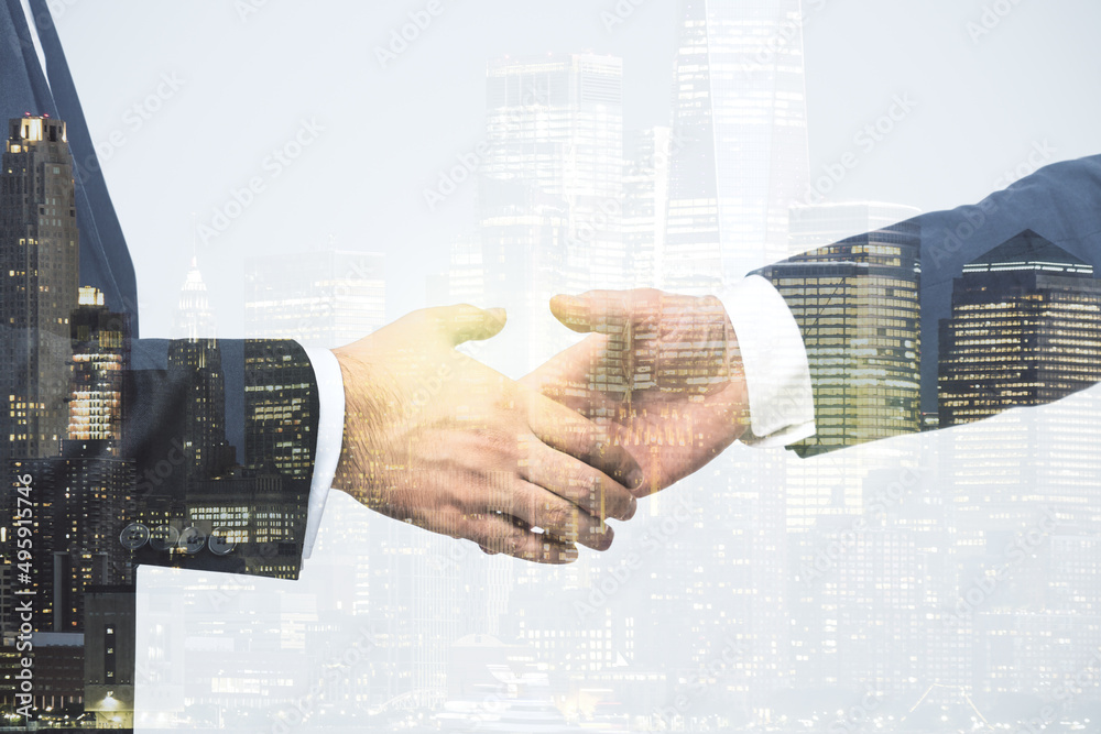 Handshake of two businessmen on modern city skyline background, deal ...