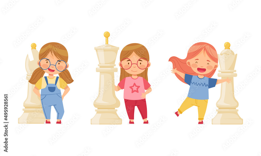 Little girls with big chess pieces. Kids playing chess logic game ...