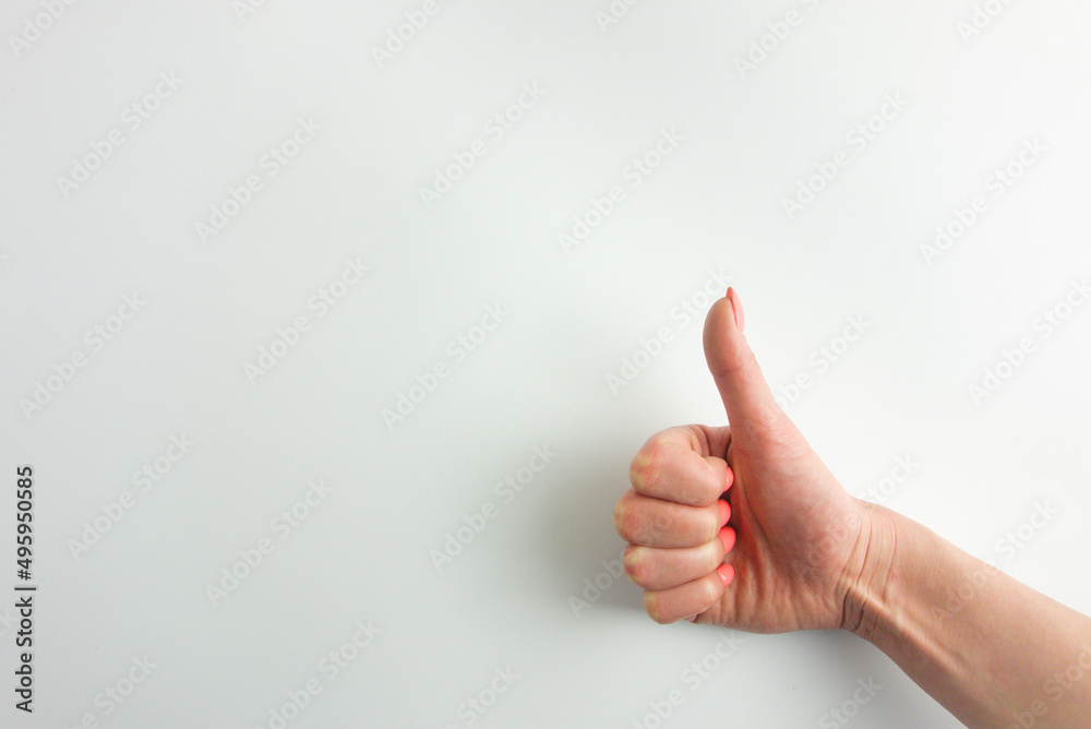 Female palm making thumbs up gesture. Woman's hand is isolated on white ...