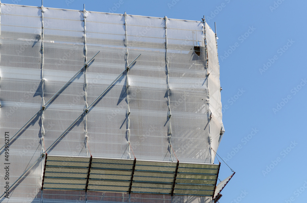 Construction: Scaffolding structure with anti-falling debris sheet ...