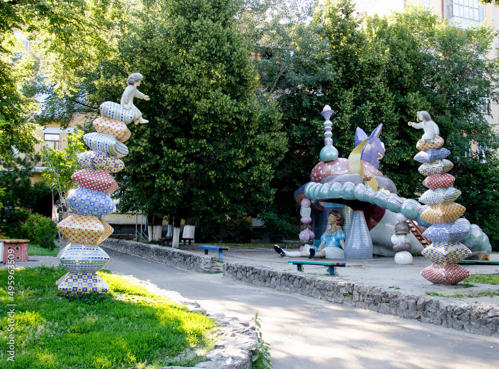 sculptures of alice in wonderland on the landscape alley in summer ...