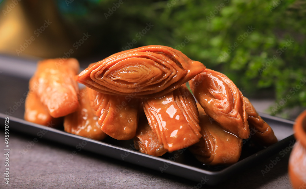 khaja south indian famous sweet closeup with selective focus and blur ...