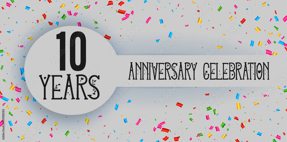 10 Years Anniversary Celebration with colored confetti on grey ...