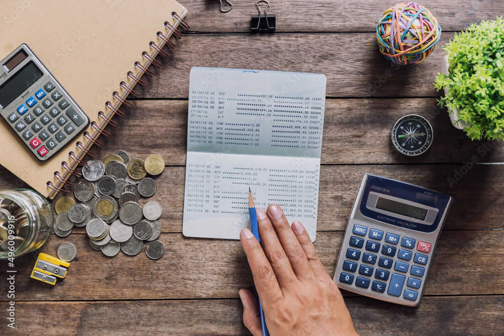 Accountant verify the Saving Account Book and Statement of financial ...