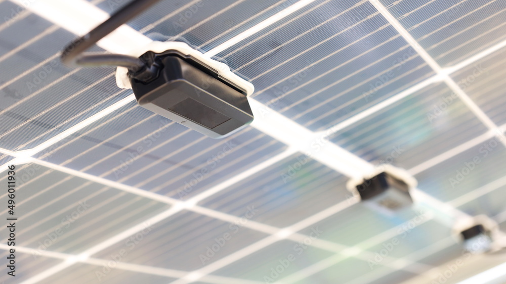 Solar junction box. A row of black diode blocks is mounted under the ...