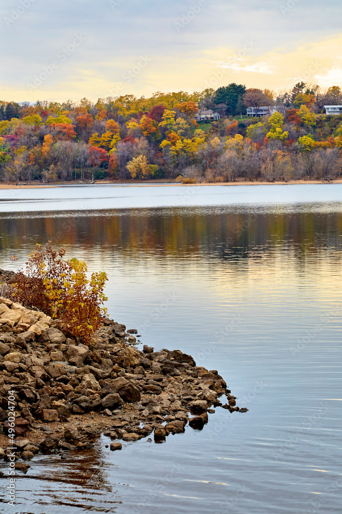 Coastline of a beautiful river with leaves turning colors and ...