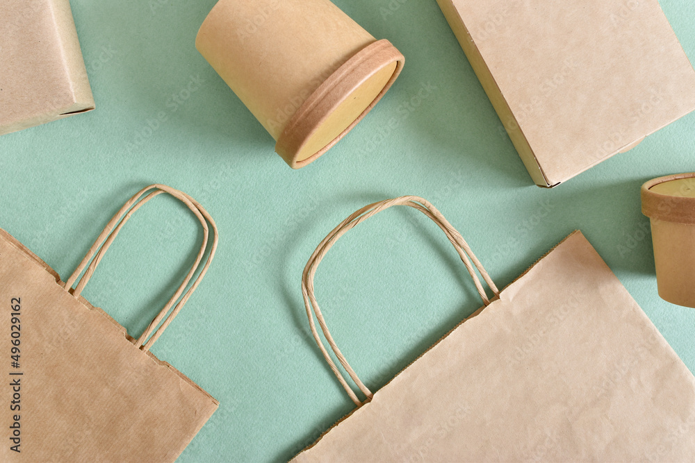 Paper packaging on a green background. Takeaway food delivery. Eco ...