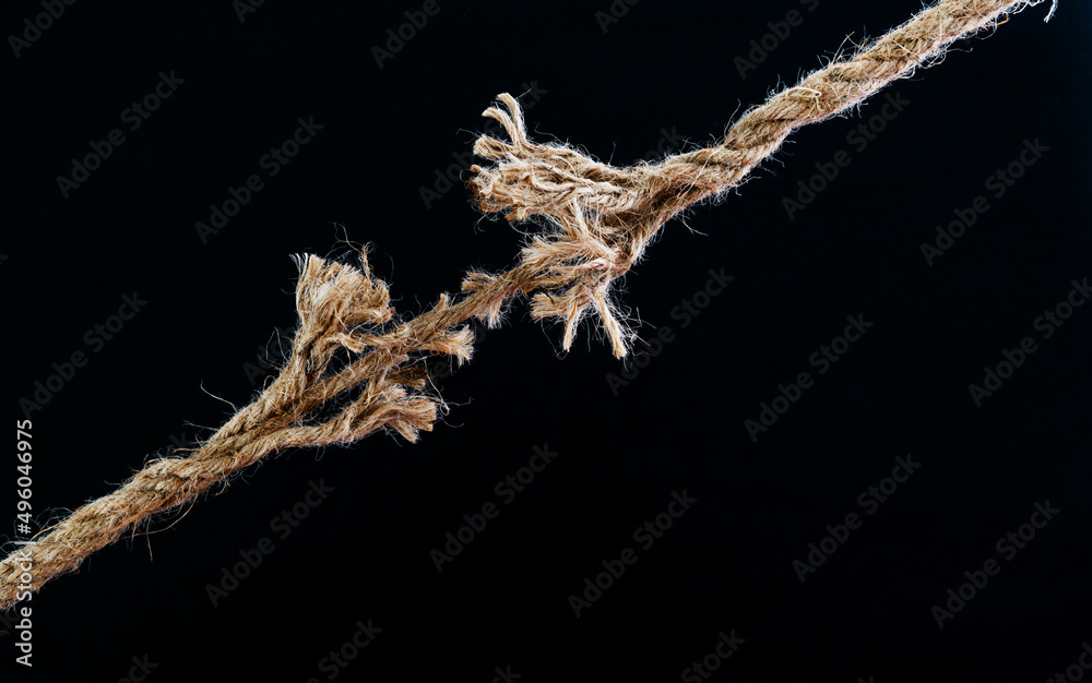 Broken rope on black background Stock Photo | Adobe Stock