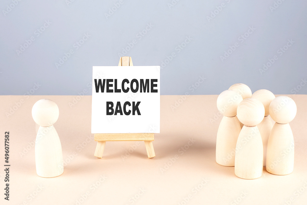 WELCOME BACK text on easel with wooden figure, meeting concept Stock ...