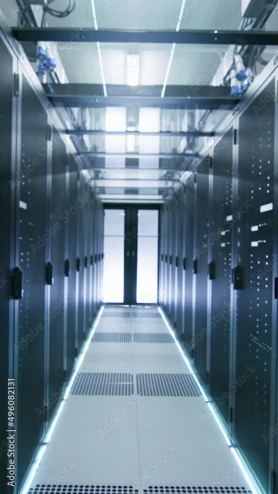 Camera Walk-Through Shot of a Working Data Center With Rows of Rack ...
