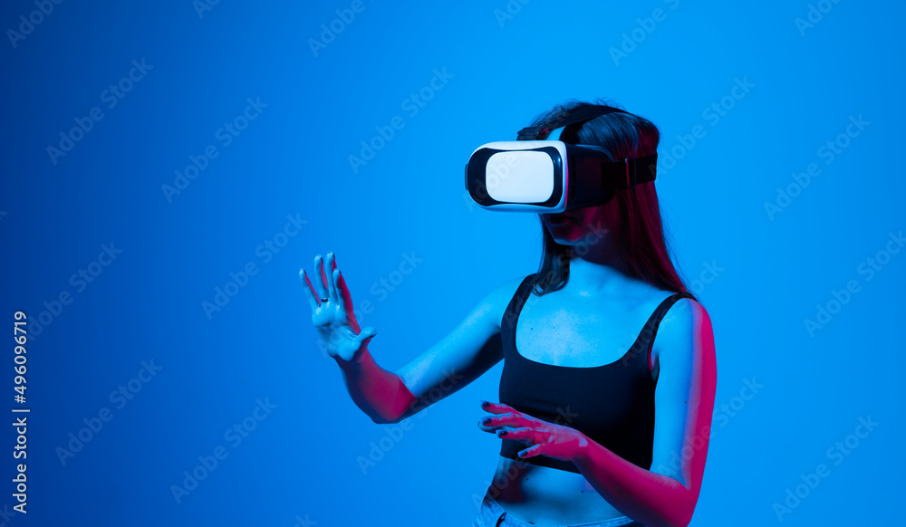 Amazed woman getting experience using glasses of virtual reality and ...
