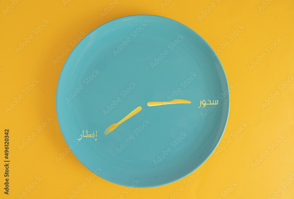 Ramadan Kareem creative minimal concept. Blue plate with knife and fork ...