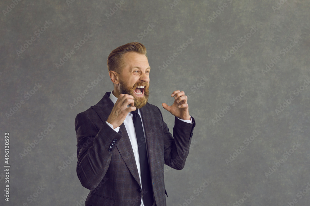 Studio portrait of angry furious businessman screaming loudly raising ...