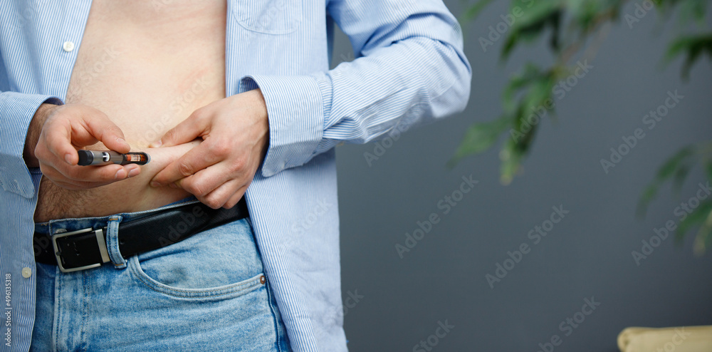 Plakát Body part photo of a man with syringe making insulin injection ...