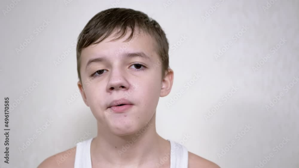Stockvideo Smiling Boy Chewing Gum Looking at the Camera. Close-up. A ...