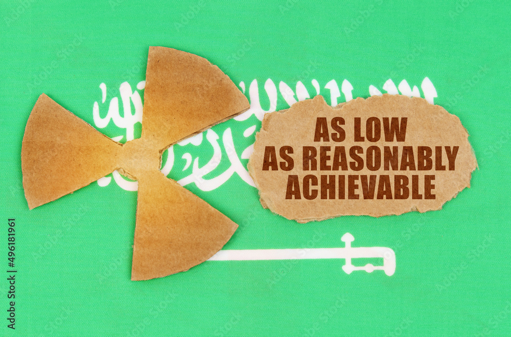 On the flag of Saudi Arabia, the symbol of radioactivity and torn ...