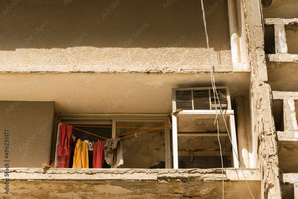 Laundry hanging in a window of a poor middle eastern home Stock Photo ...