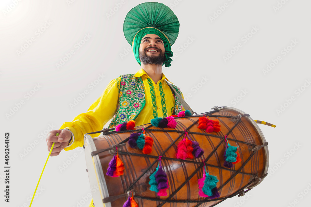Portrait of Sikh man playing drum during Baisakhi celebration Stock ...