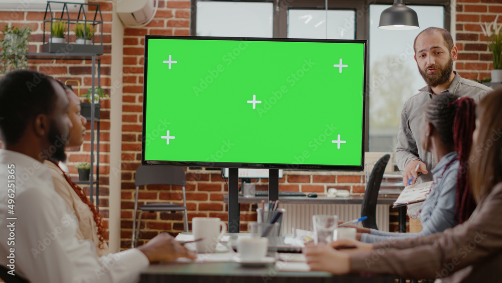 Man doing presentation with isolated green screen on display in ...