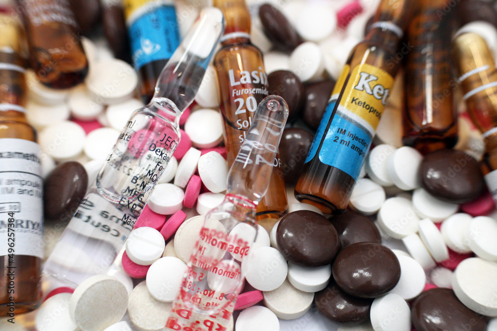 Cairo, Egypt, January 15 2022: selective focus of tablets and ampules ...