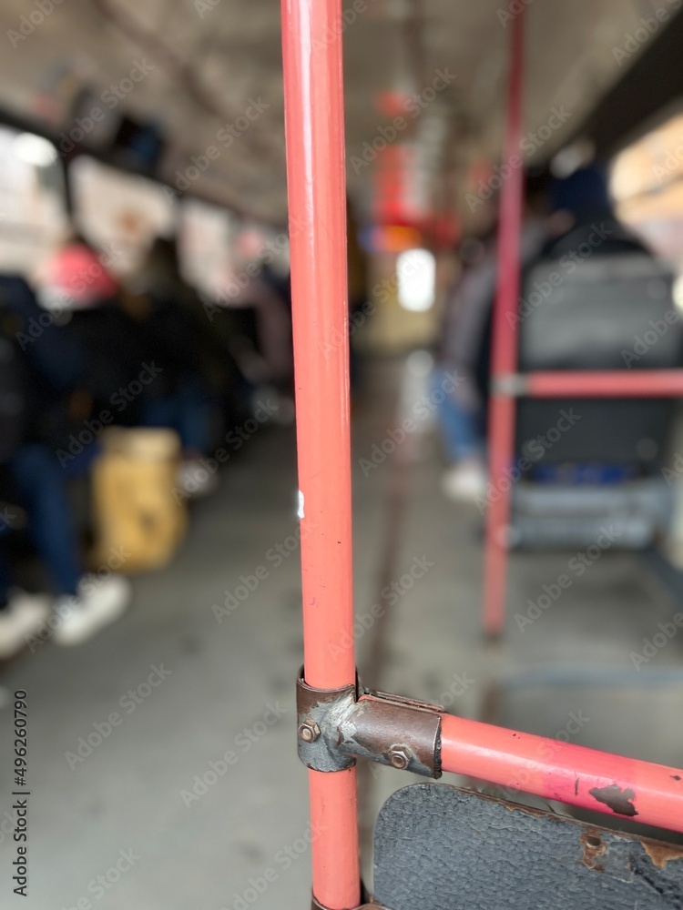 Passengers of public transport commute to work. A group of people ride ...