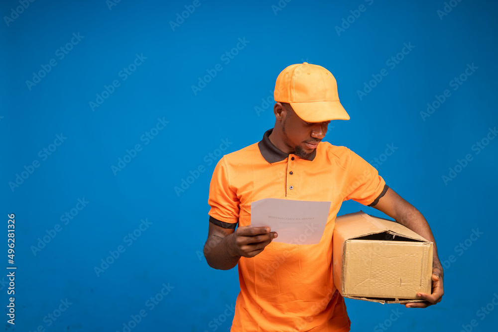 african american delivery man carrying parcel and presenting receiving ...
