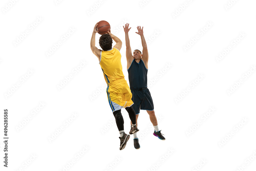 Full-length portrait of two young basketball players jumping with ball ...