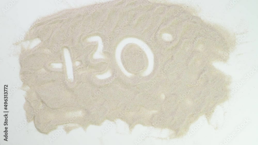 plus 30 degrees Top view draw on the sand. Caucasian hands write text ...