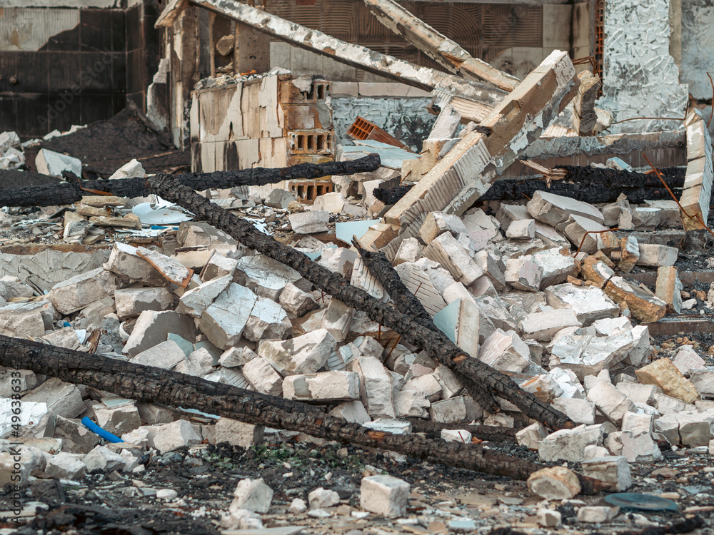 Close up Destroyed and burnt civilian building after rocket attack ...
