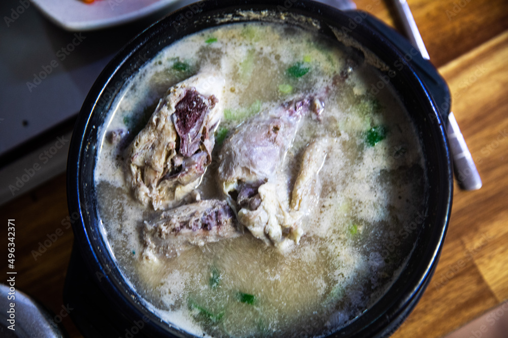 Nutritious samgyetang cooked with one chicken, glutinous rice, green ...