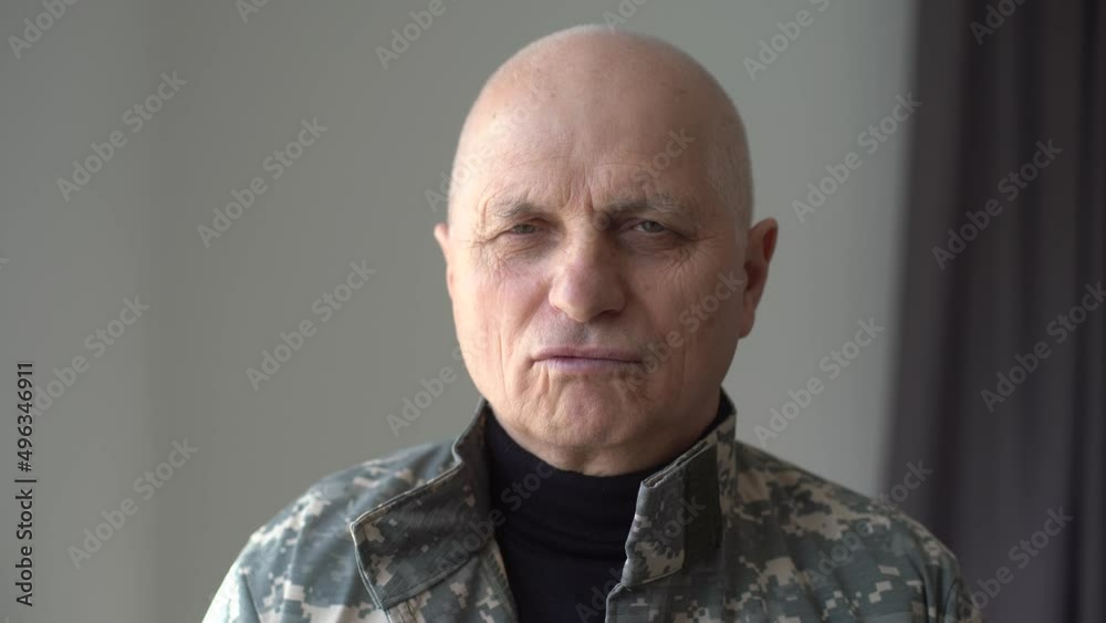 Portrait of eldery pilot or military man or train driver in cap with ...