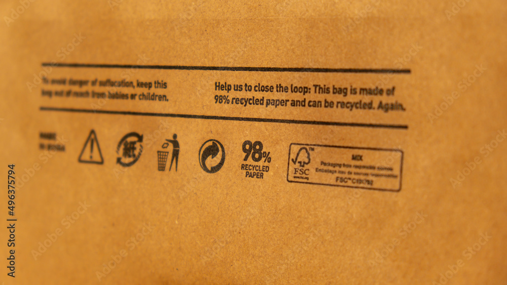 Recycling bag Closeup view of pap sign and other eco-label on Brown ...